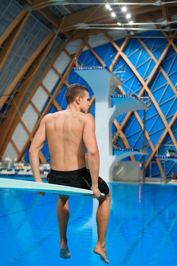 Swimmer Sits on a Platform for Diving Stock Photo - Image of muscular ...