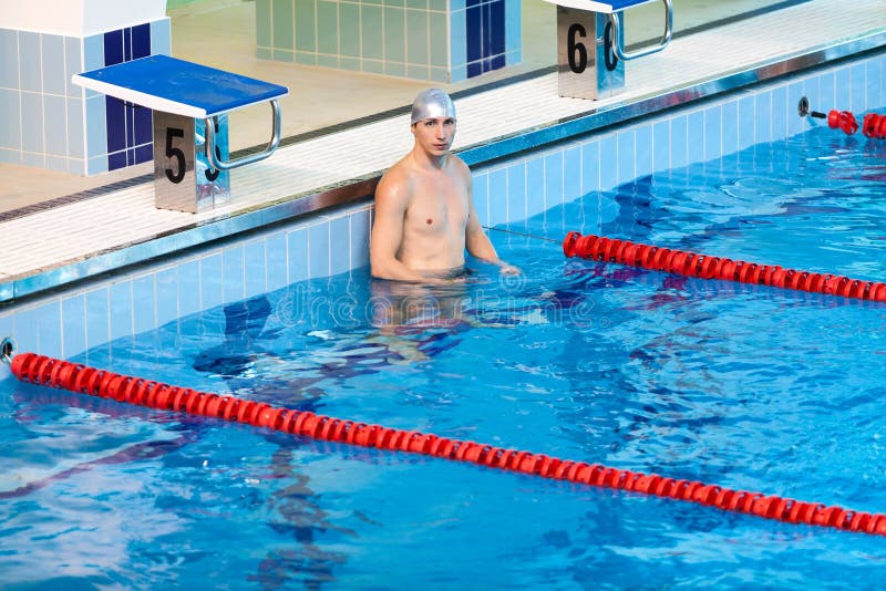 Swimmer Standing in Water of Swimming Pool Stock Photo - Image of ...