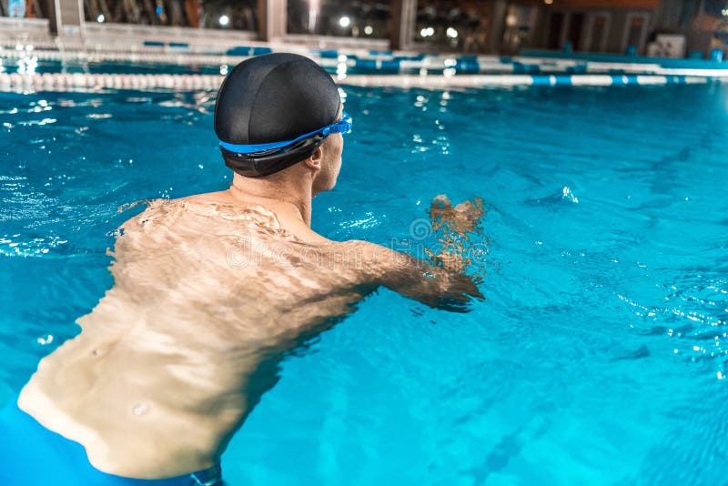 Swimmer in swimming pool stock photo. Image of sporty - 129497410