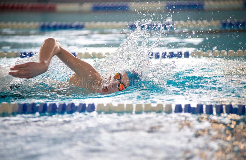 Swimmer Boy Swims Butterfly Swimming Style in the Pool Stock Photo ... Swimmer Boy Swims Butterfly Swimming Style in the Pool Stock Photo ...