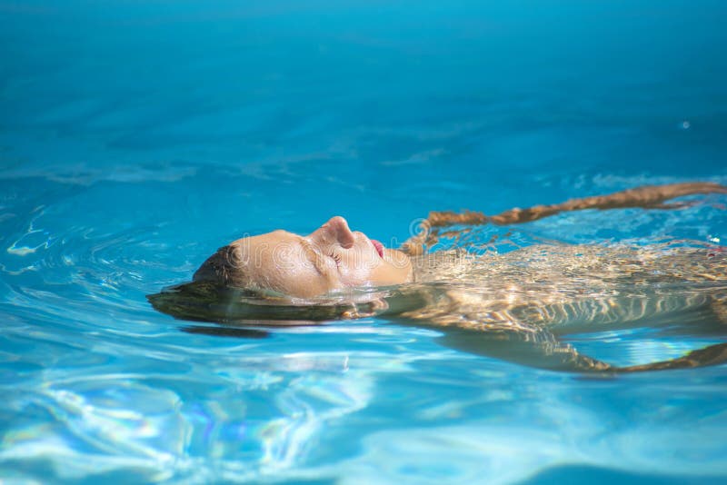 Swimming on the Back in the Refreshingly Pool Stock Image - Image of ...