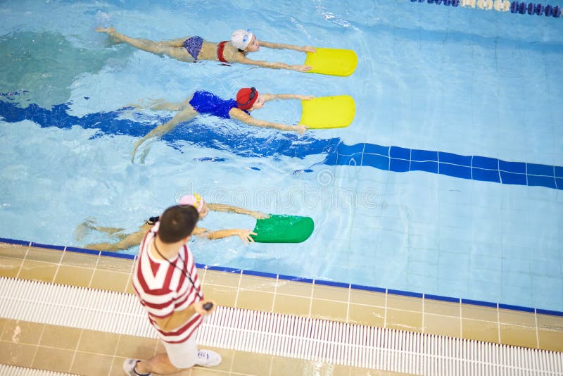 Children Training with Coach in Pool Stock Photo - Image of pool, water ...
