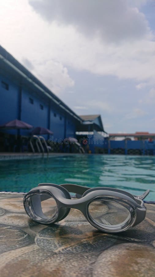 Swimming Goggles by the Poolside at Day Stock Photo - Image of swimwear ...