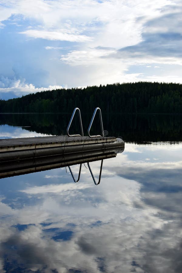 Swimming Pier on Calm Lake with Reflection Stock Photo - Image of ...
