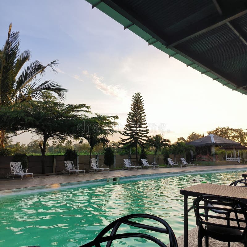 Swimming Pool in the Afternoon Stock Photo - Image of afternoon, sunset ...