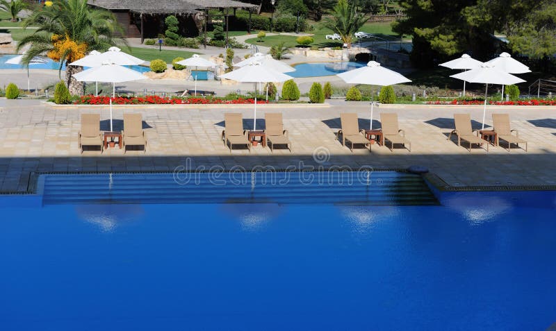 Swimming pool area stock image. Image of palm, greece - 11670055