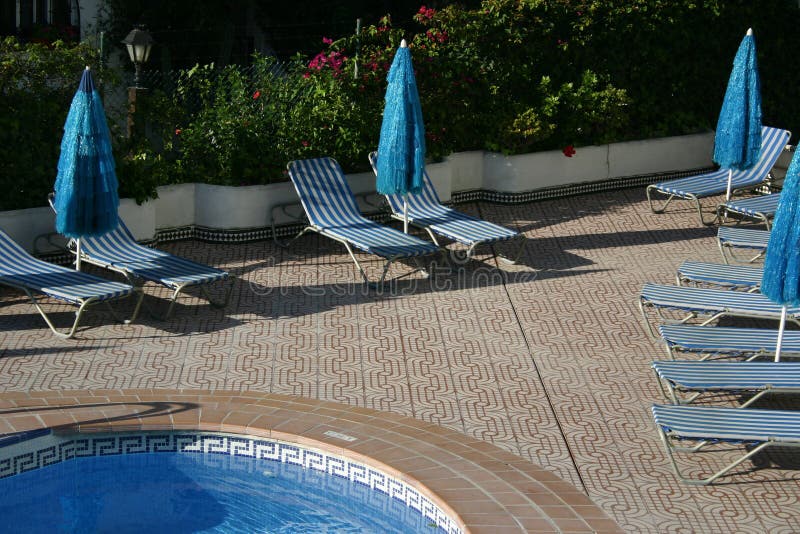 Swimming pool area stock photo. Image of resort, umbrellas - 1728166