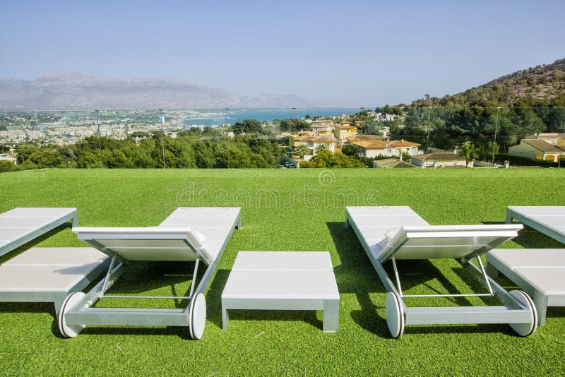 Swimming Pool Area with White Sun Beds at the Modern Resort. Stock ...