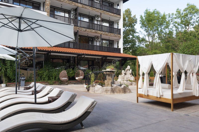 Swimming Pool Area with White Sun Beds. Summer Vacation Stock Image ...