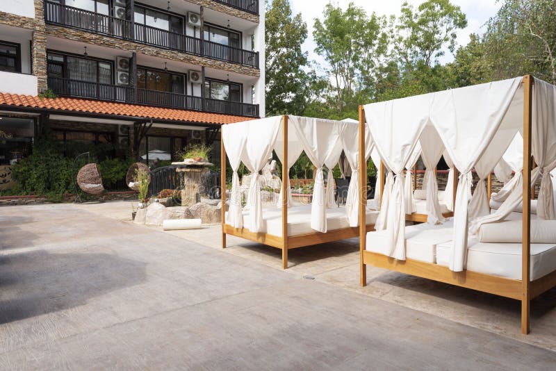 Swimming Pool Area with White Sun Beds. Summer Vacation Stock Image ...