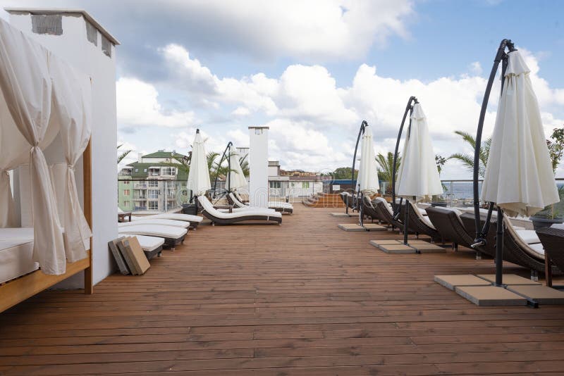 Swimming Pool Area with White Sun Beds. Summer Vacation Stock Image ...