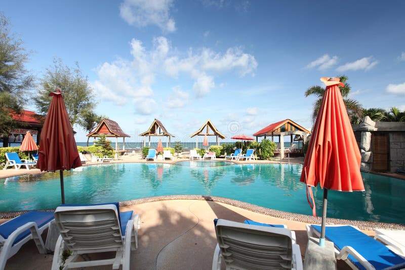 Swimming pool and beach stock photo. Image of relaxation - 141545416