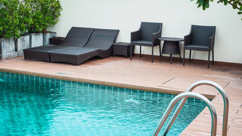 Seat on patio by the pool. stock photo. Image of home - 119095356
