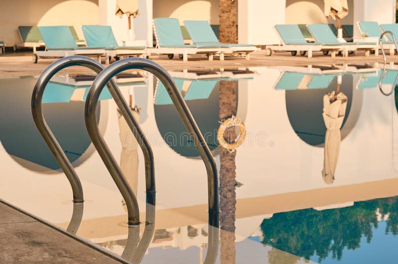 Swimming Pool with Blue Water and a Metal Staircase Stock Image - Image ...