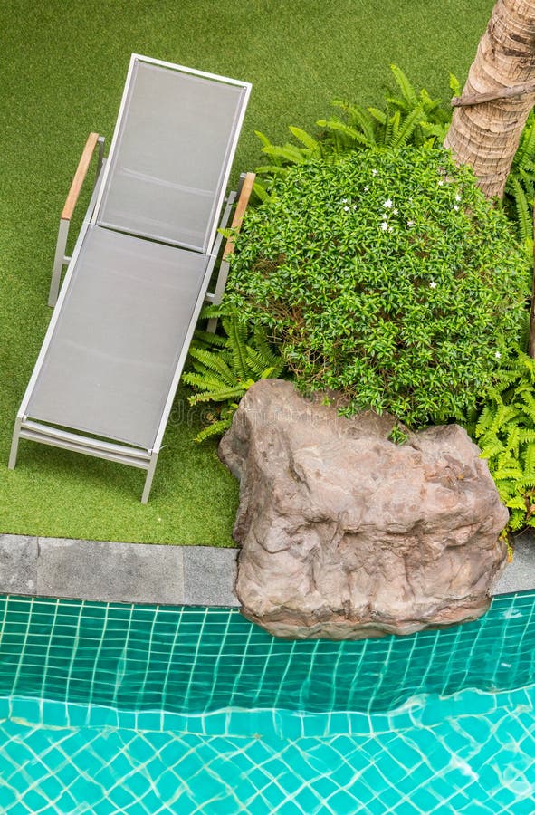 Swimming pool chair. stock image. Image of coconut, lawn - 55361527