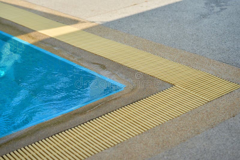 Swimming Pool Corner with Water Drainage Grate with Shady Stock Image ...