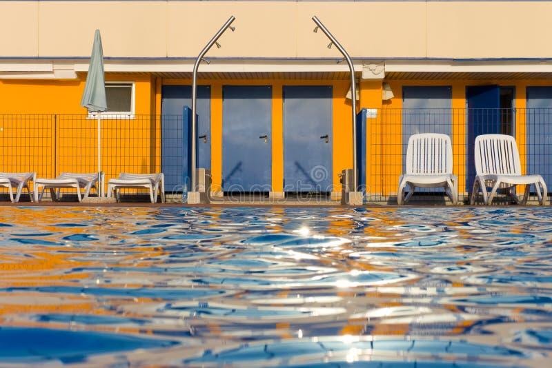 Swimming pool entrance stock image. Image of deckchairs - 26300439