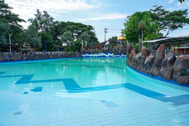 The Swimming Pool is Equipped with Various Water Rides, One of Which is ...