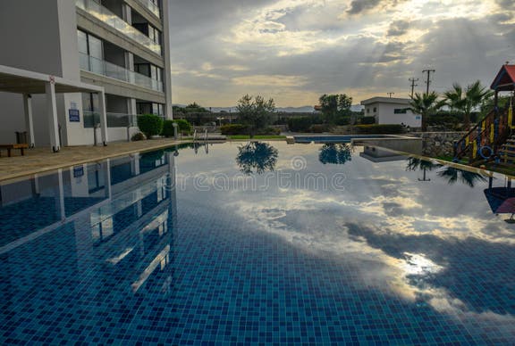 Swimming Pool in the Evening Sun 1 Stock Photo - Image of building ...