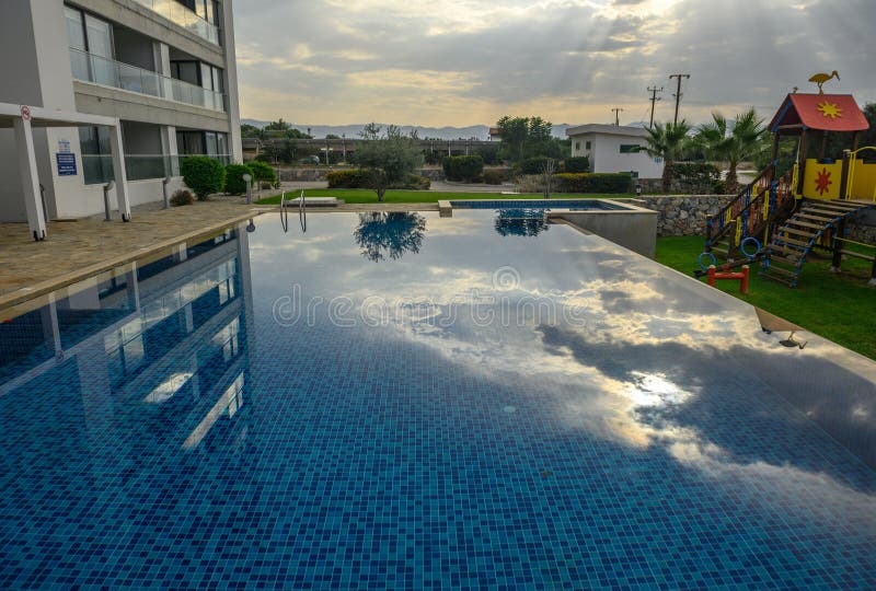 Swimming Pool in the Evening Sun 2 Stock Image - Image of water, patio ...