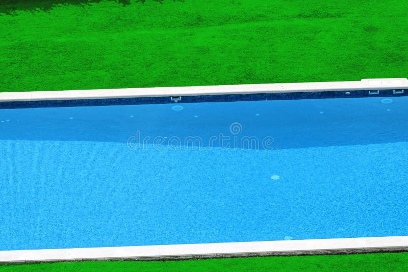 Swimming pool and grass stock image. Image of color - 173259359