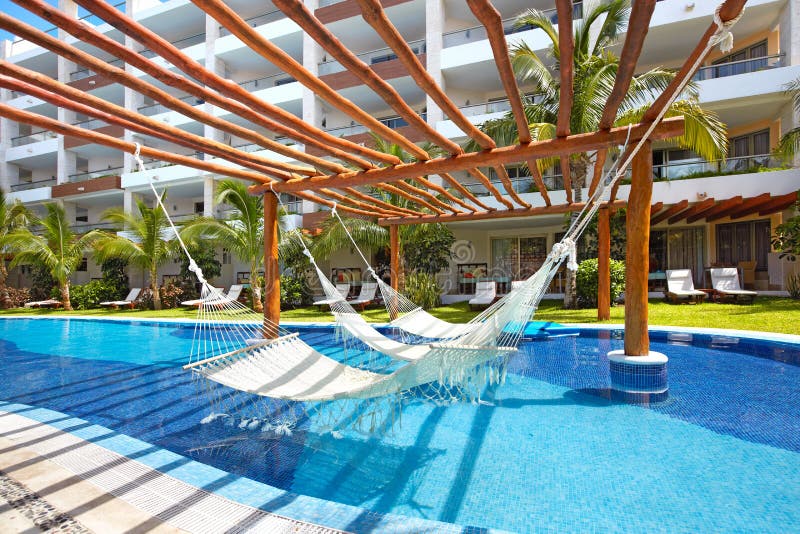 Swimming pool and hammock. stock photo. Image of mexico - 89821324