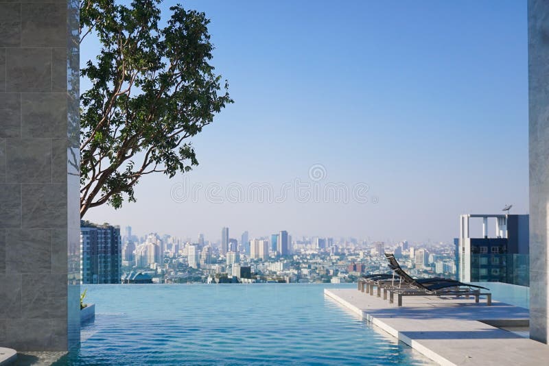 Swimming Pool. Swimming Pool on the High Rise Building with Cityscape ...
