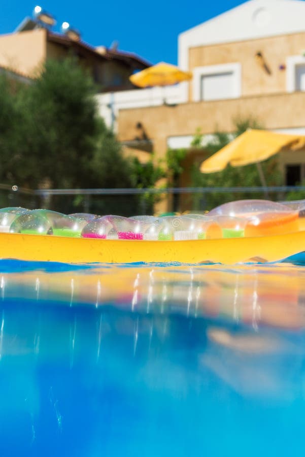 Swimming Pool with Inflatable Raft. Stock Image - Image of raft, sunny ...