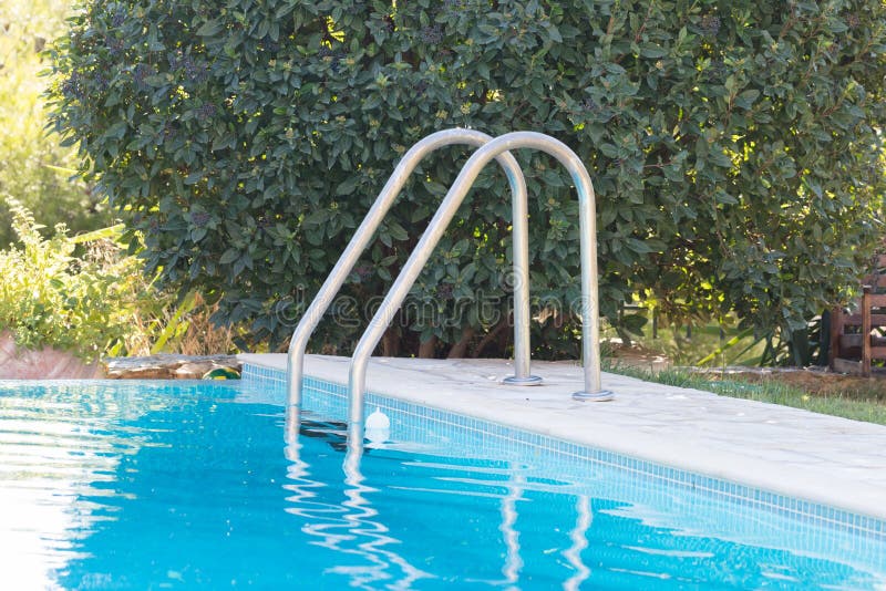Swimming pool with ladder stock photo. Image of holoday - 103458440