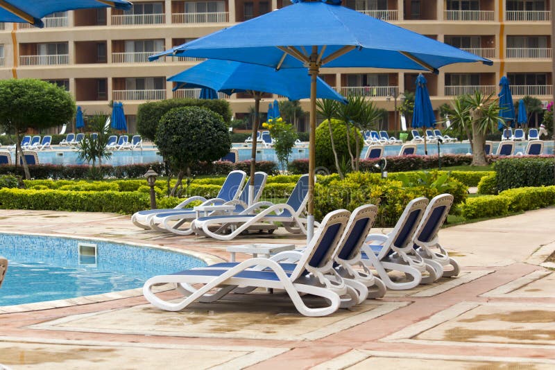 Swimming Pool Lounge Chairs Stock Photo - Image of elegant, calm: 27923046