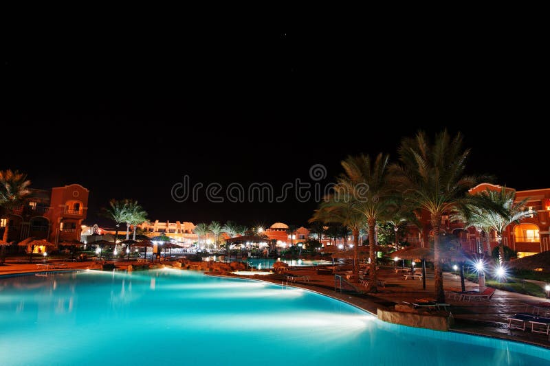 Swimming Pool of a Luxury Tropical Caribbean Resort at Night Stock ...
