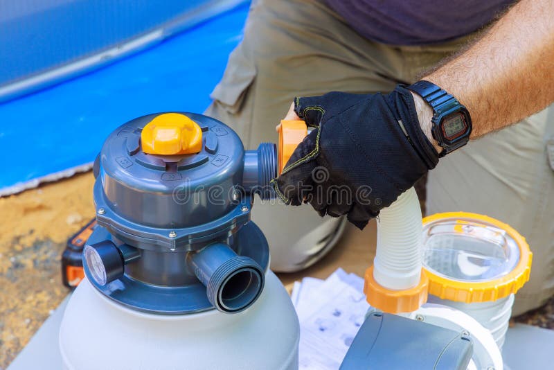 Swimming Pool Maintenance Workers Assemble a Sand Filter System Tank ...