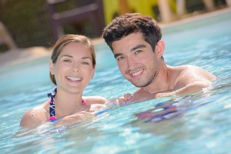 Friends in a swimming pool stock photo. Image of pool - 9149744