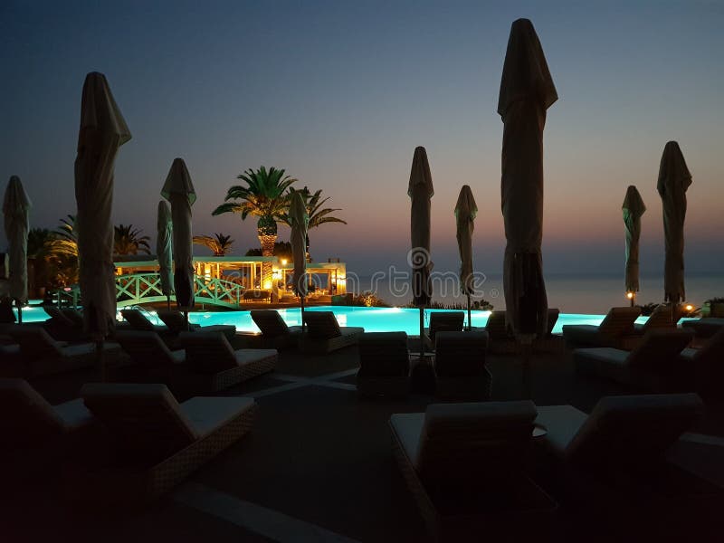 Swimming pool at night stock image. Image of light, reflection - 244927319