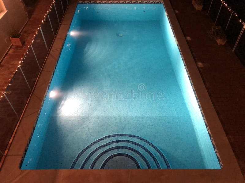 Swimming pool at night stock image. Image of swimming - 135415775