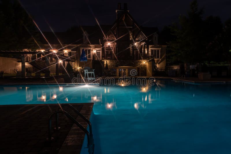 Swimming Pool at Night stock image. Image of curved - 209720197