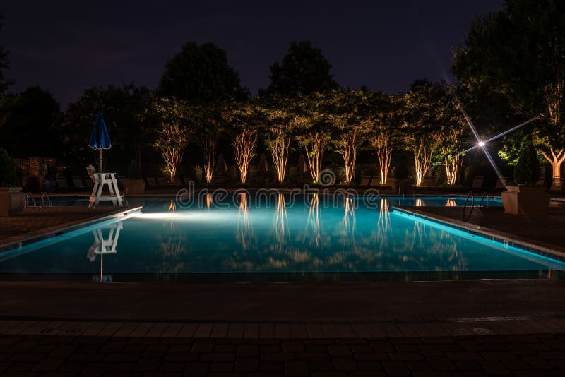 Swimming Pool at Night stock photo. Image of chaise - 209720206