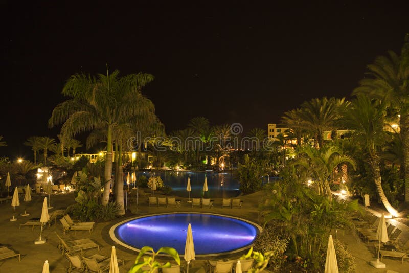 Swimming pool night scene stock image. Image of landscaped - 49050587