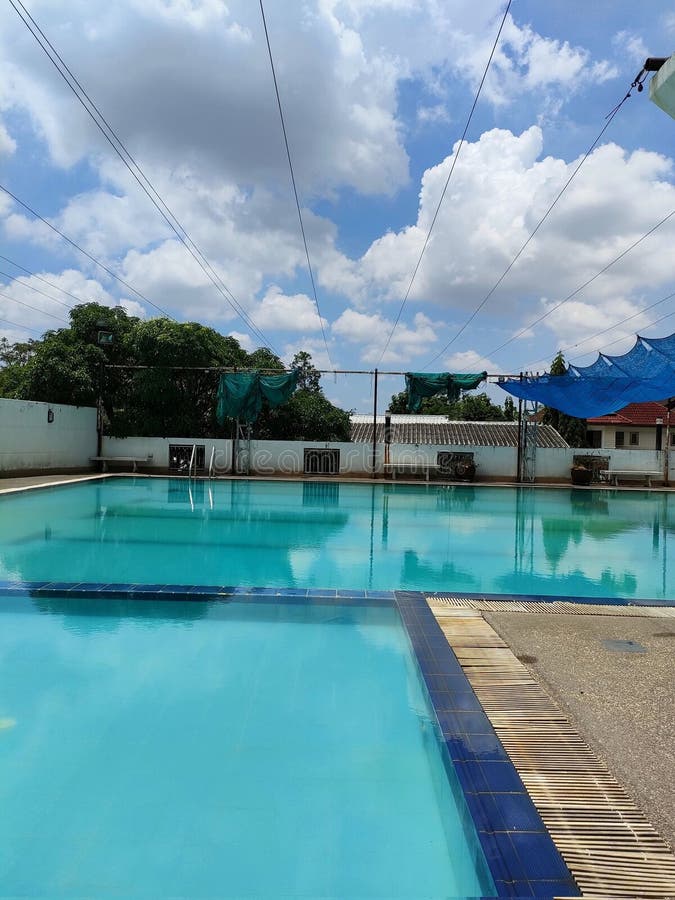 Swimming pool in the park stock image. Image of beautiful - 275637735