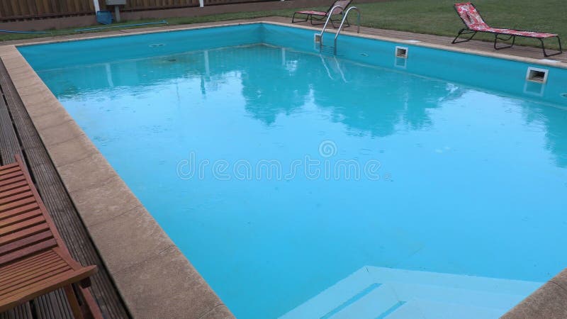 Swimming pool in rainy day stock video. Video of slow - 100356905
