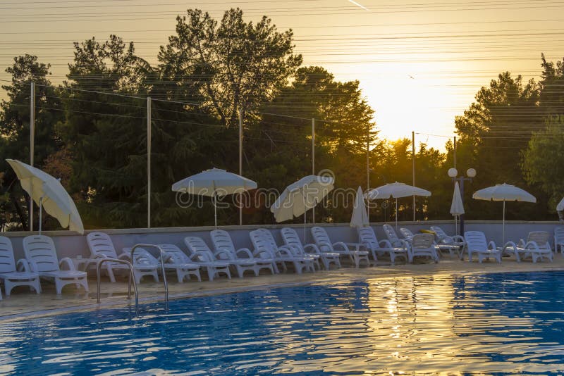 Swimming Pool in the Rays of Setting Sun Stock Photo - Image of ...