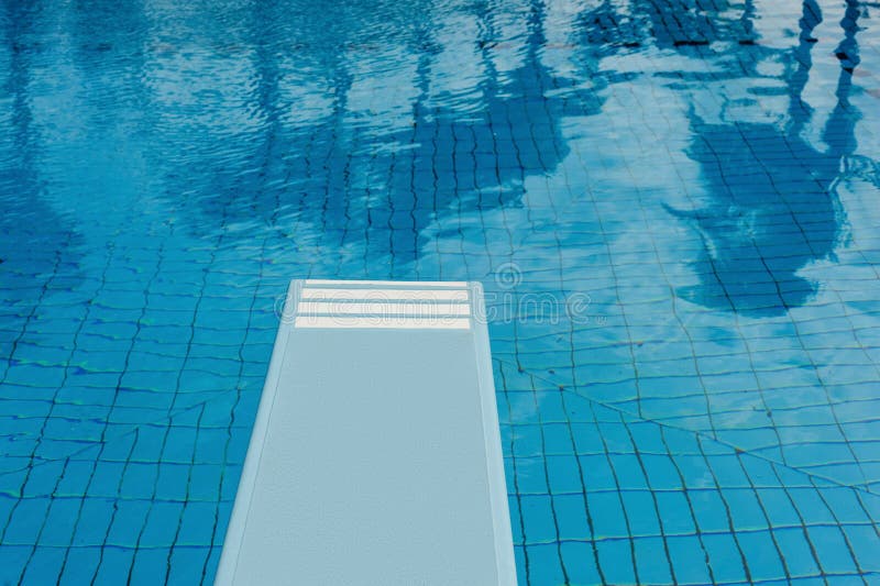 Swimming Pool with Refreshing Blue Water, Springboard and Reflection ...
