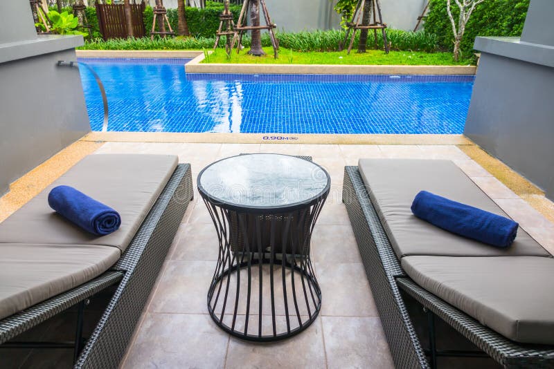 Swimming Pool with Relaxing Seats Near the Sea . Stock Photo - Image of ...