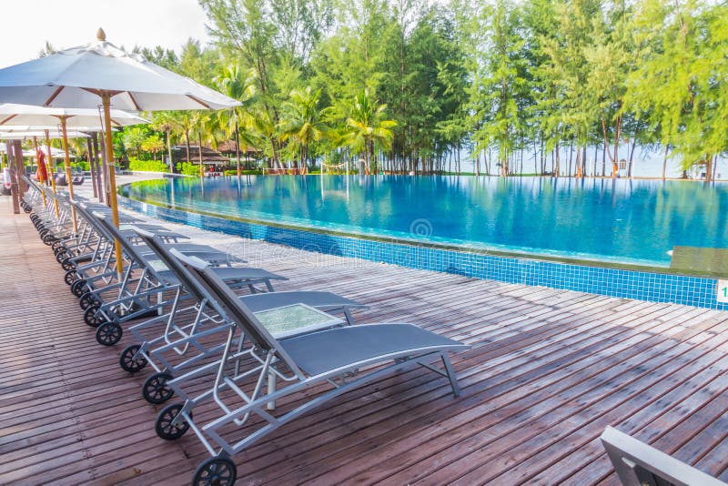 Swimming Pool with Relaxing Seats Near the Sea . Stock Photo - Image of ...