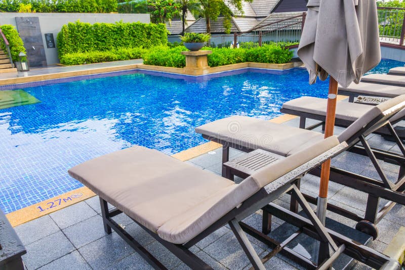 Swimming Pool with Relaxing Seats Near the Sea . Stock Photo - Image of ...