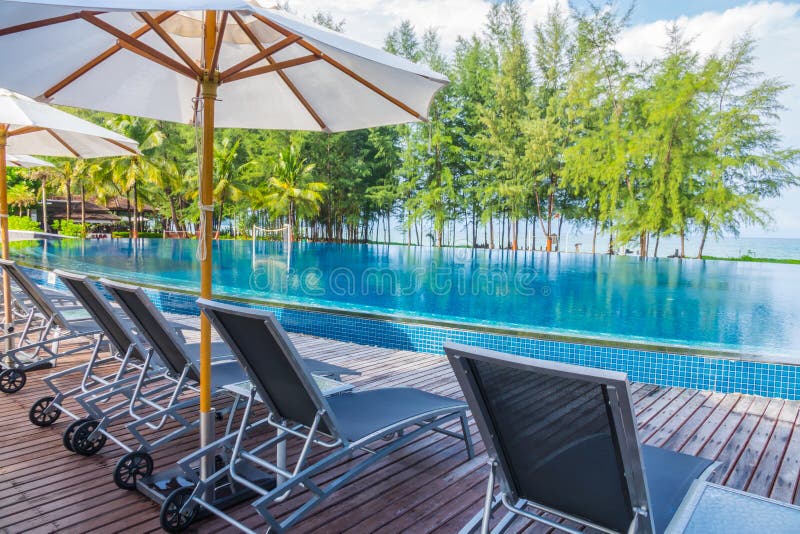 Swimming Pool with Relaxing Seats Near the Sea . Stock Image - Image of ...