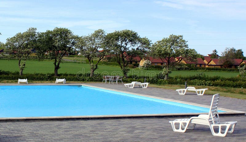 Swimming pool in a resort stock image. Image of stone - 223397089