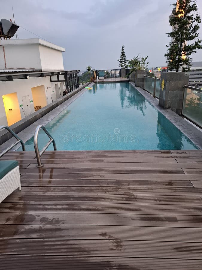 Rooftop swimming pool stock photo. Image of water, walkway - 323783298