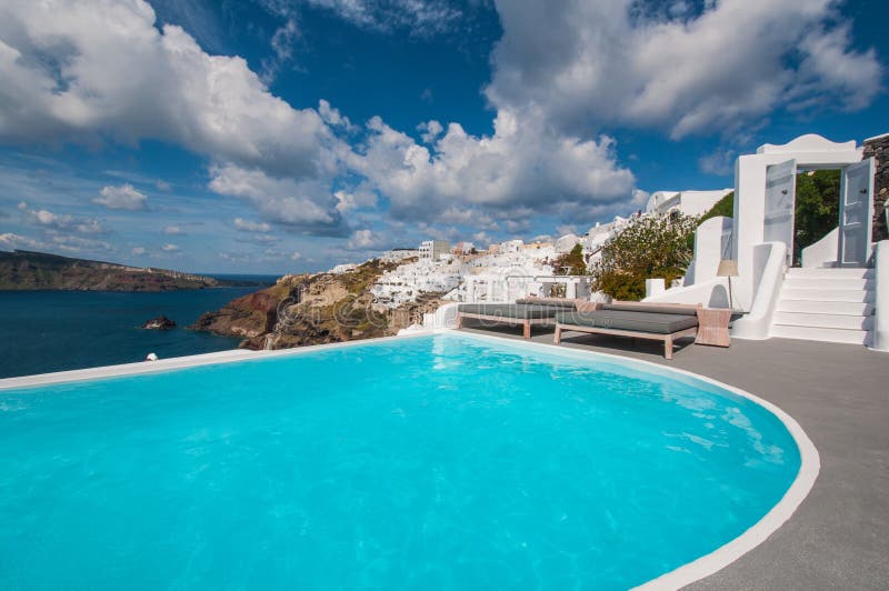 Swimming pool in Santorini stock photo. Image of agean - 53694250