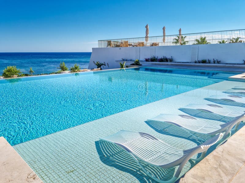 Swimming Pool with Sea View Stock Photo - Image of couple, relax: 282247944